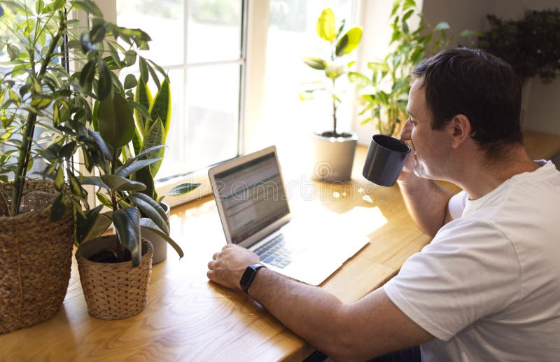 Young Personal Development Coach Answering the Client by Email by a ...