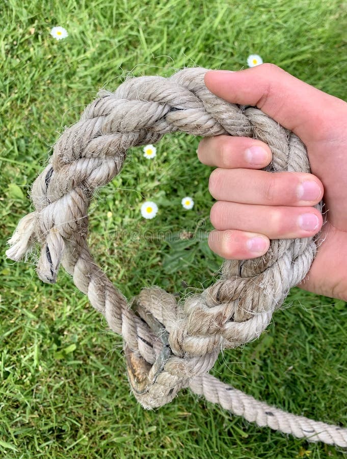 Hand holding a rope loop stock image. Image of holding - 182029813