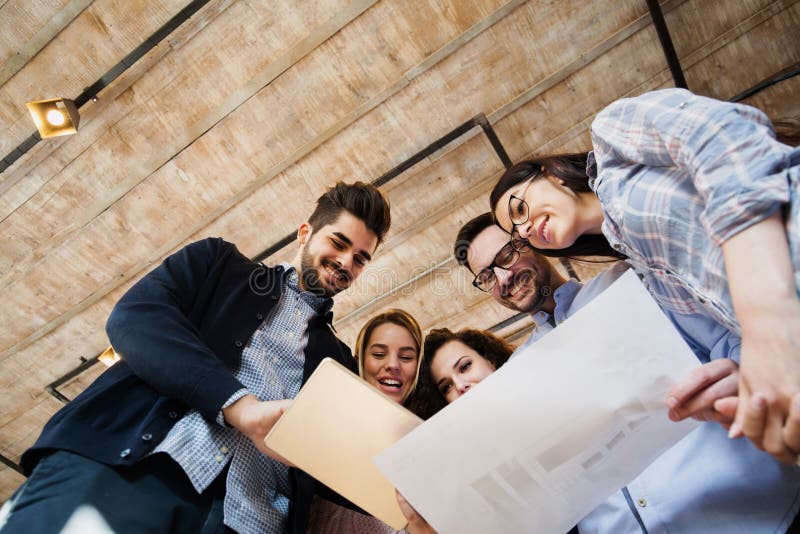 Young Perspective Designers Looking at Project Schemes Stock Photo ...