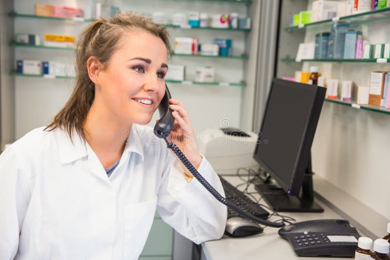 Young Pharmacist on the Phone Stock Photo - Image of indoors, female ...