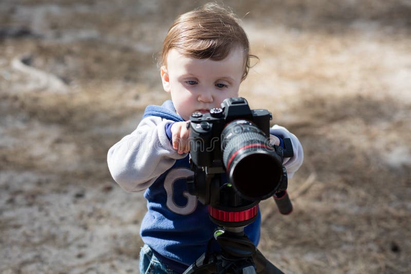 Young Photographer Child Taking Photos with Camera on a Tripod Stock ...