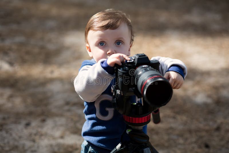 Young Photographer Child Taking Photos with Camera on a Tripod Stock ...