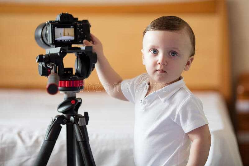 Young Photographer Child Taking Photos with Camera on a Tripod Stock ...