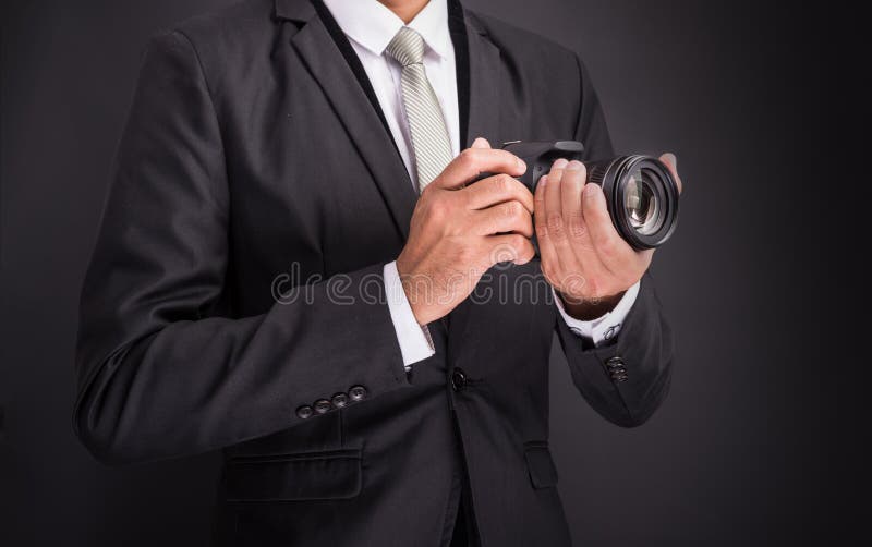 Young Photographer Man Holding Camera Stock Photo - Image of lens, male ...