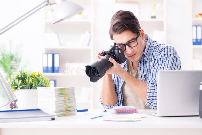 Young Photographer Working in Photo Studio Stock Photo - Image of flash ...