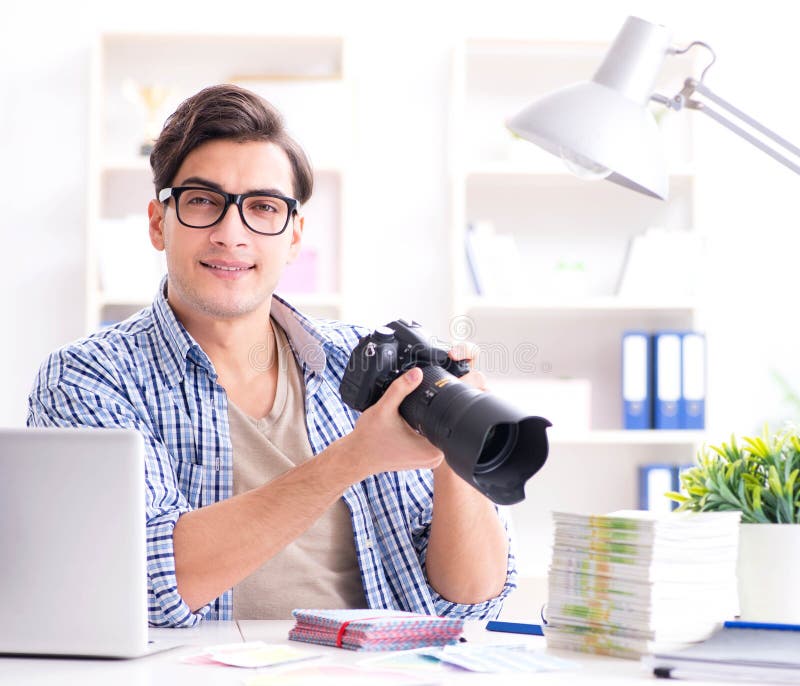 Young Photographer Working in Photo Studio Stock Photo - Image of ...