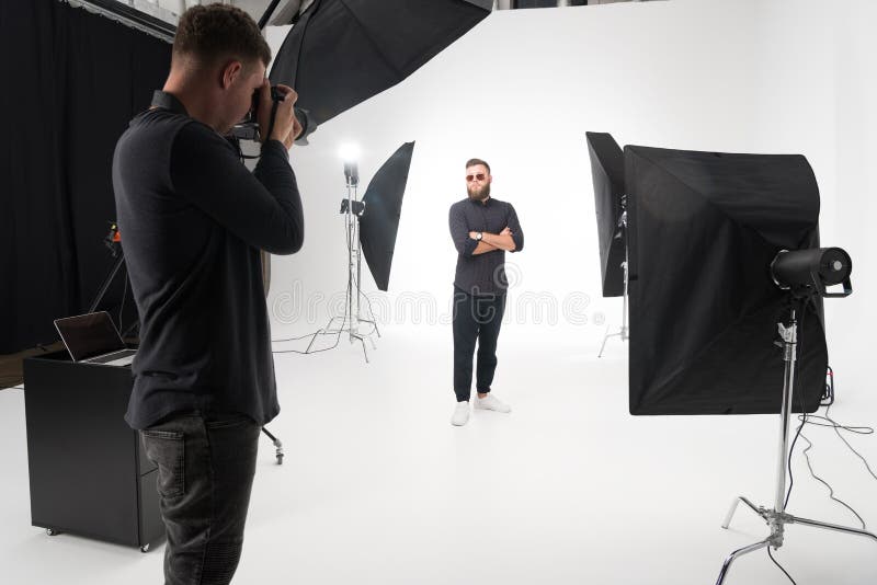 Photographer Working in Studio with Model Stock Photo - Image of ...