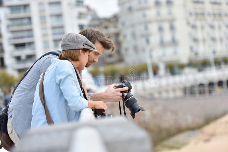 Young Photographers Checking Photo Shots Stock Image - Image of ...