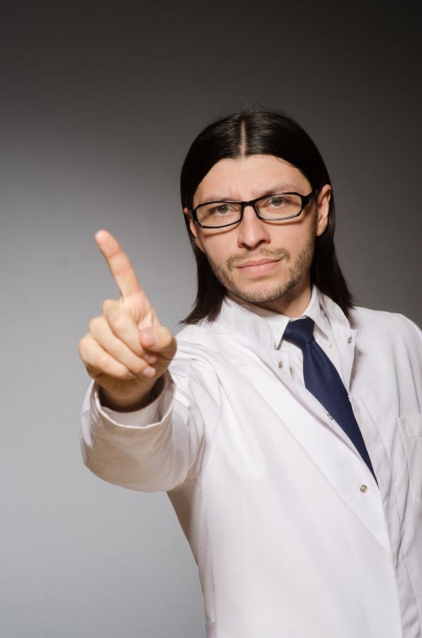 The Young Physician Against Gray Stock Photo - Image of specialist ...