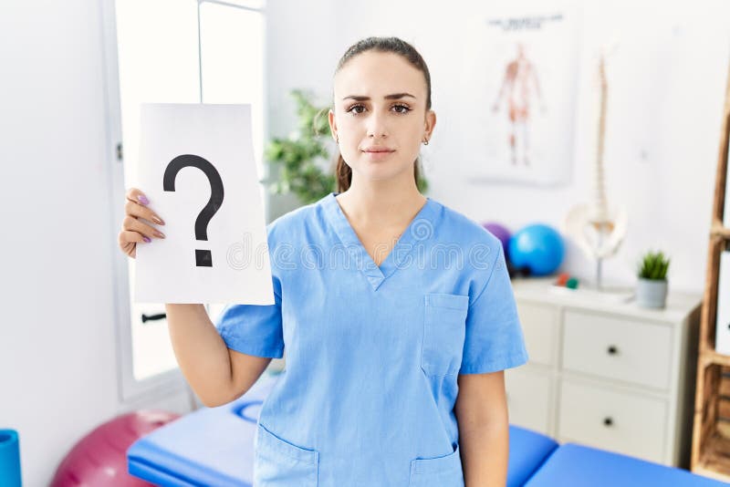 Young Physiotherapist Woman Holding Question Mark Thinking Attitude and ...