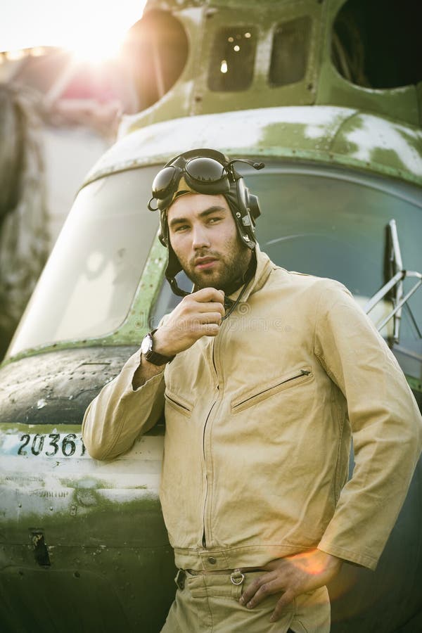 Young Pilot Posing Near the Helicopter Stock Image - Image of outdoor ...