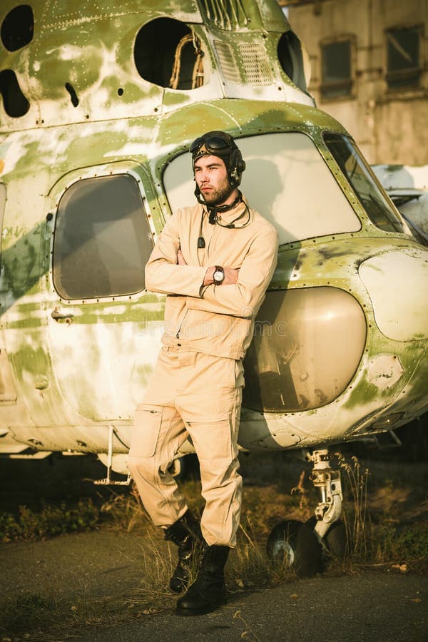 Young Pilot Posing Near the Helicopter Stock Image - Image of caucasian ...