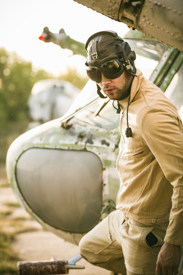 Young Pilot Posing Near the Helicopter Stock Photo - Image of ...