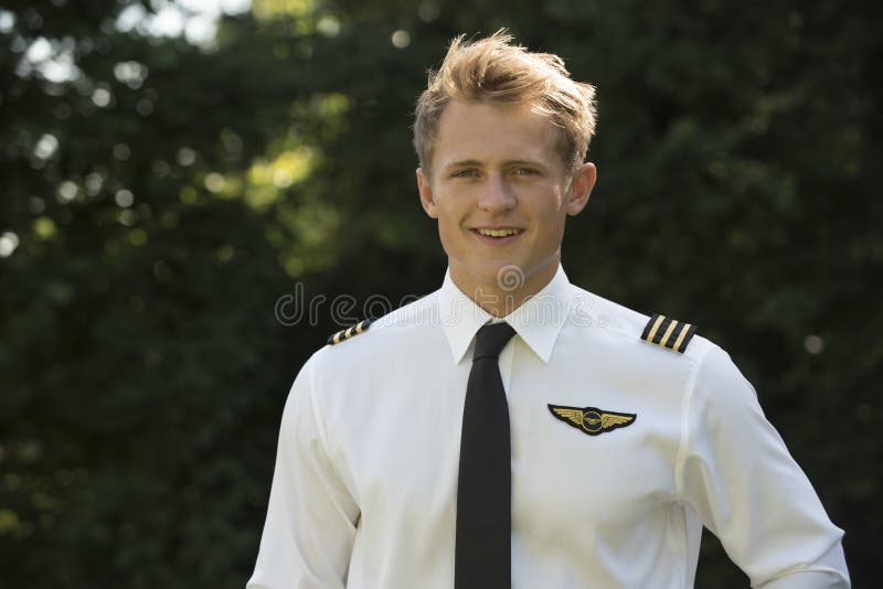 Young Pilot with Long Brown Hair and Uniform Hat Stock Image - Image of ...