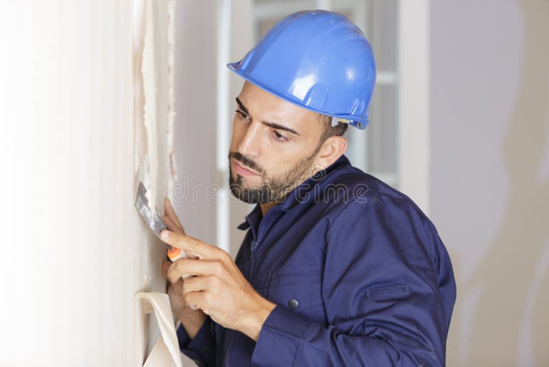 Plasterer at work stock image. Image of grey, hard, drywall - 31992299