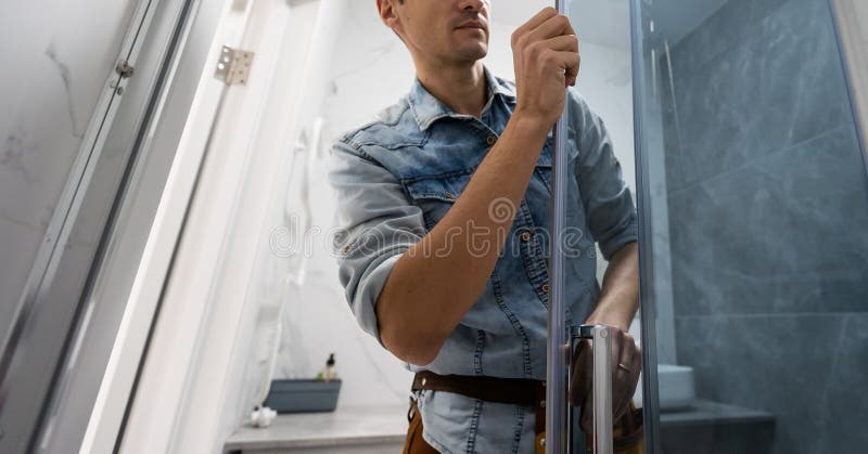 Young Plumber Fixing Shower Cabin Stock Photo - Image of instrument ...