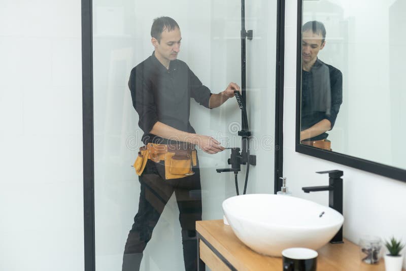 Young Plumber Fixing Shower Cabin. Stock Photo - Image of install ...