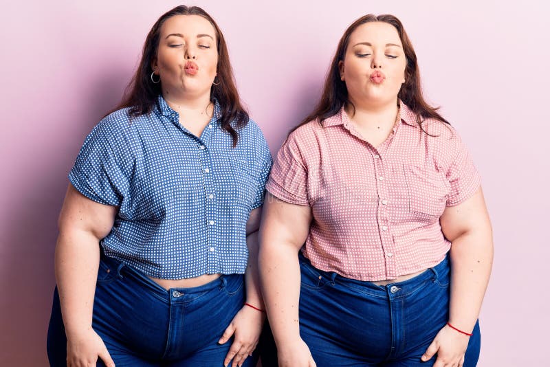 Young Plus Size Twins Wearing Casual Clothes Making Fish Face with Lips ...