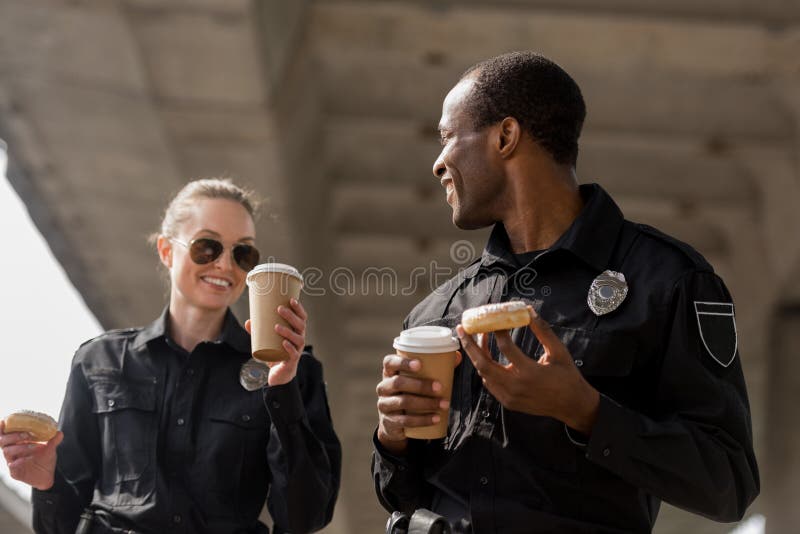 Young Police Officers Having Coffee Break Stock Image - Image of ...