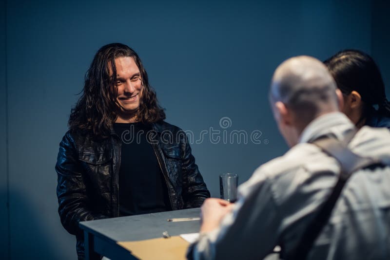 Young Police Officers are Interrogating, the Suspect Laughs Audaciously ...