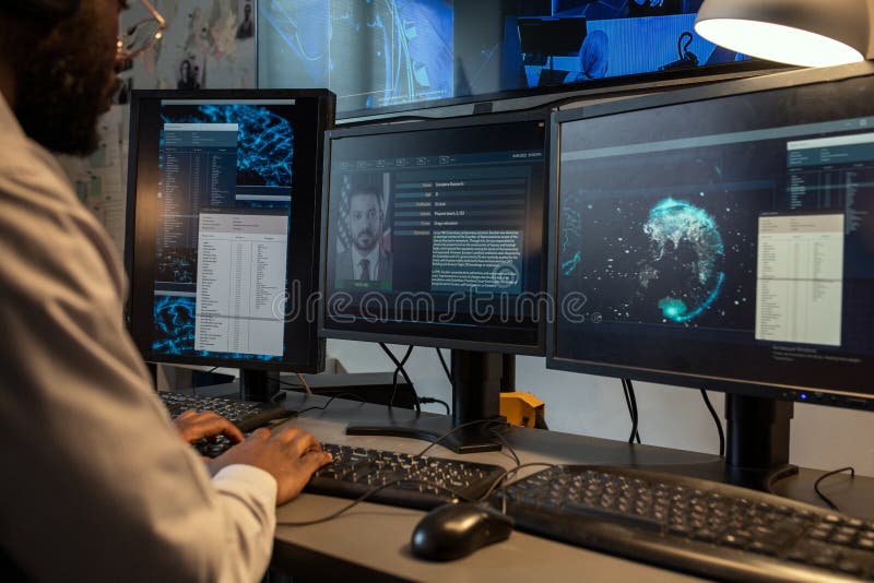 Young Policeman Entering Personal Data of Suspect into Computer ...