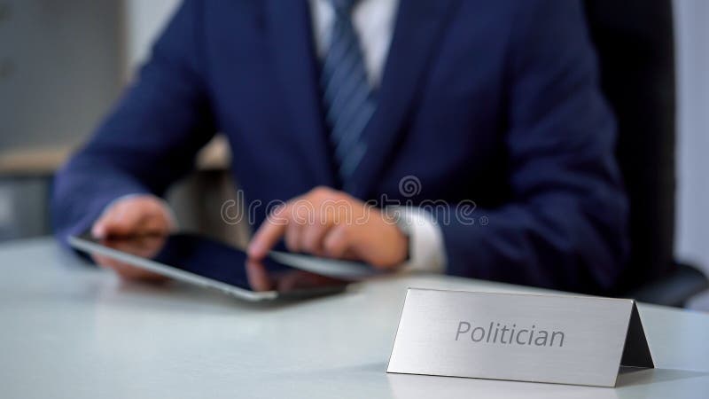 Young Politician Working on Tablet Computer, Preparing Electoral ...