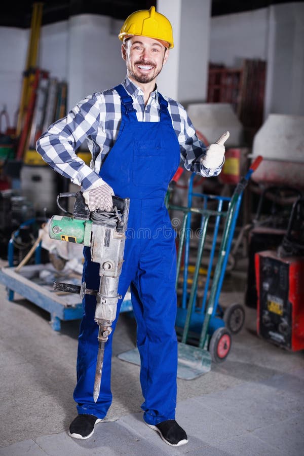 Young Positive Guy Using Jackhammer at Workshop Stock Image - Image of ...