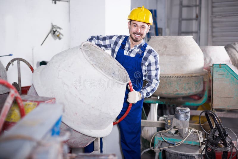 Positive Man Worker Displaying Various Motorcycles in Workshop Stock ...