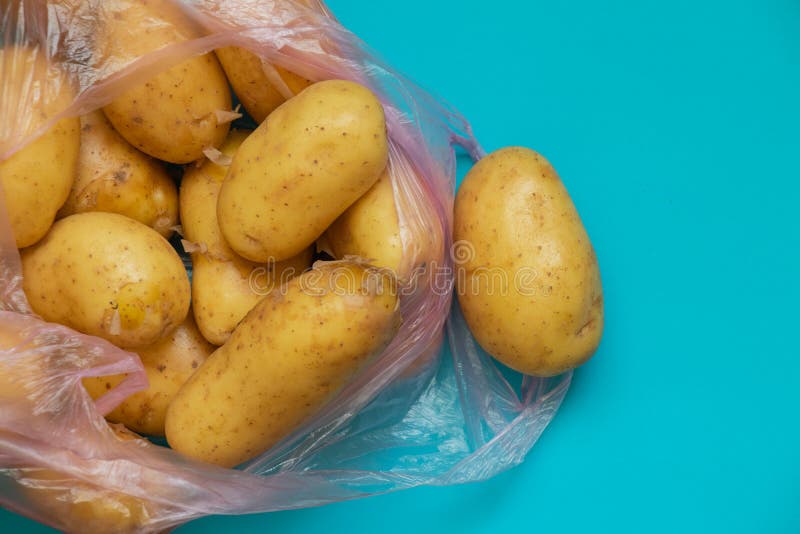 A Young Potato in a Bag on a Table Bought at a Bazaar Closeup Stock ...