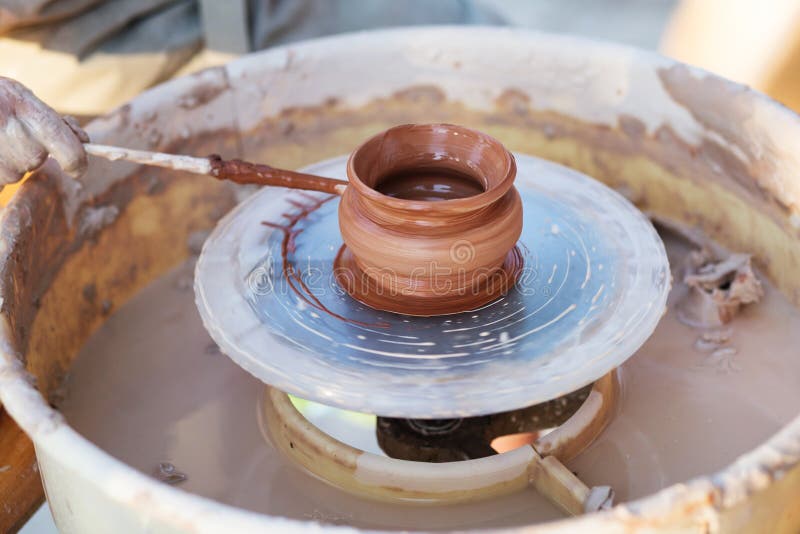 Young Potter, Creating an Earthen Jar on the Circle, Close-up Stock ...