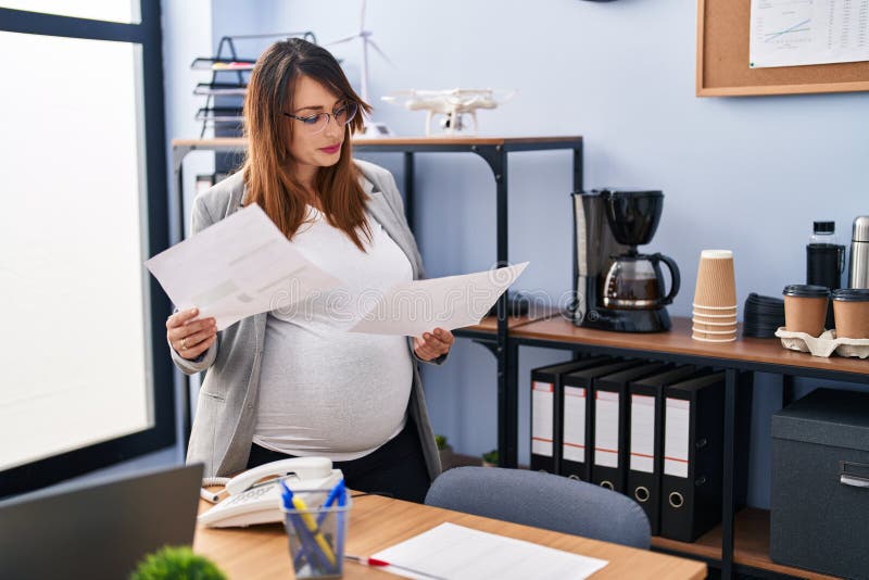 Young Pregnant Woman Business Worker Reading Document at Office Stock ... Young Pregnant Woman Business Worker Reading Document at Office Stock ...