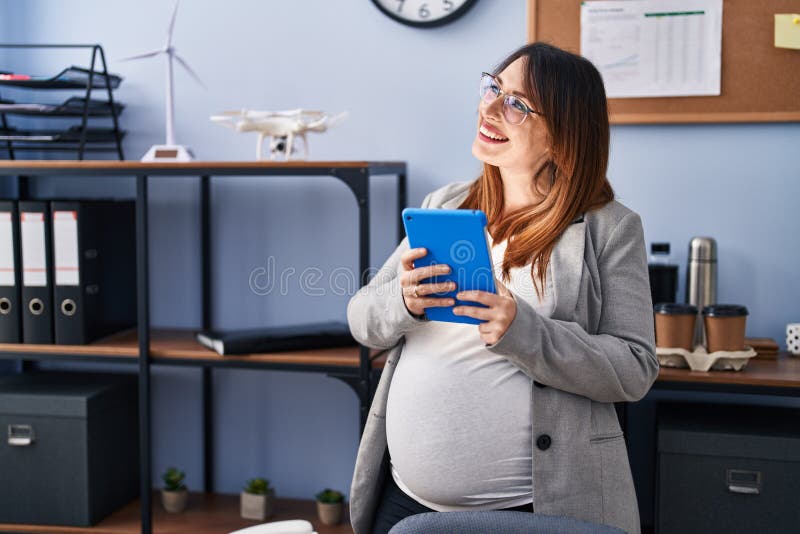 Young Pregnant Woman Business Worker Using Touchpad Working at Office ...