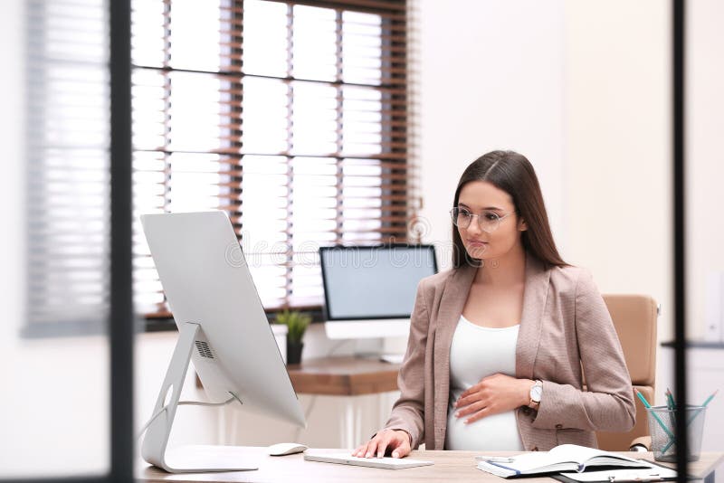 Young Pregnant Woman Working with Computer at Table Stock Photo - Image ...