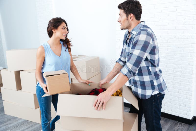 Young Pretty Couple Unpacking in New Flat Stock Image - Image of house ...