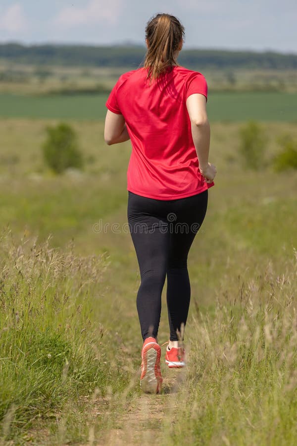 Young Pretty Girl Running on the Meadow Stock Image - Image of fitness ...
