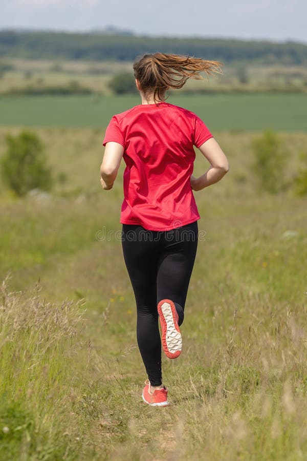 Young Pretty Girl Running on the Meadow Stock Photo - Image of motion ...