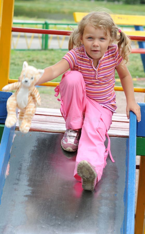 Little girl on a slide stock photo. Image of stand, wave - 32826924