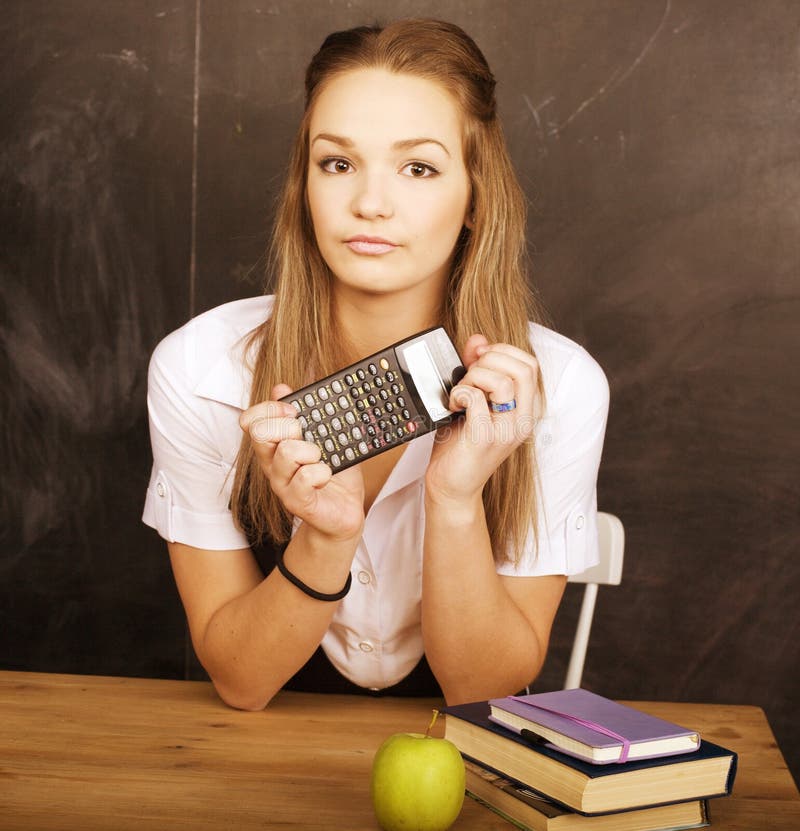 Young Pretty Girl Student in Classroom at Blackboard Stock Photo ...