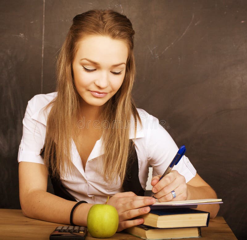 Young Pretty Girl Student in Classroom at Blackboard Stock Image ...