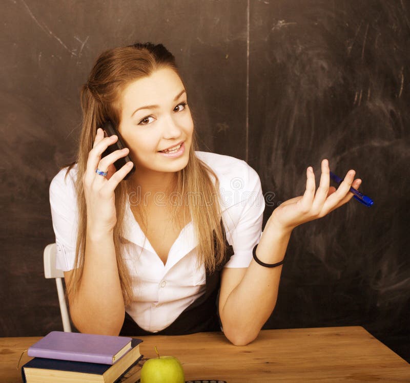 Young Pretty Girl Student in Classroom at Blackboard Stock Photo ...