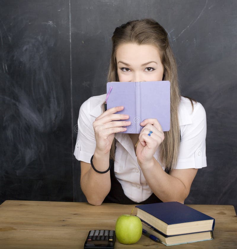 Young Pretty Girl Student in Classroom at Stock Image - Image of desk ...
