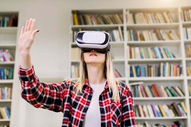 Young Pretty Girl, Student, Library User, Using VR Simulator while ...