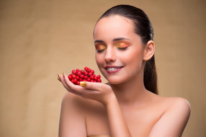 The Young Pretty Woman with Berries in Beauty Concept Stock Image ...