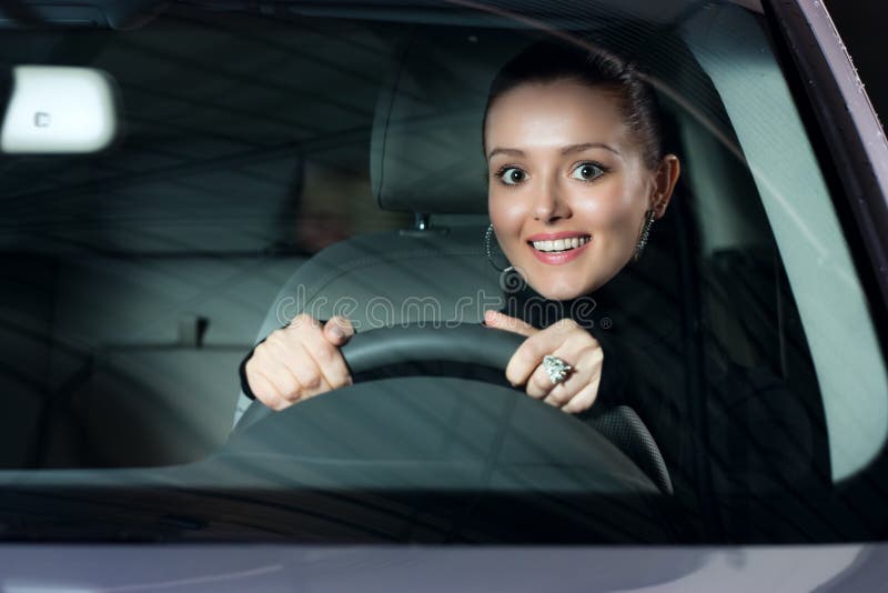 Young Pretty Woman Driving Car Stock Image - Image of caucasian, arms ...