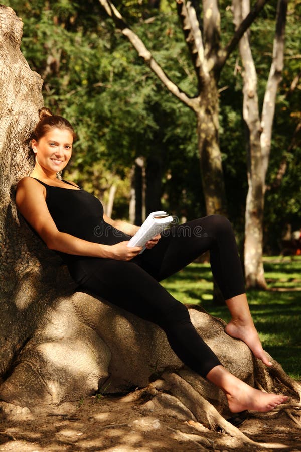 Young Pretty Woman Reading in the Park Stock Image - Image of teenager ...