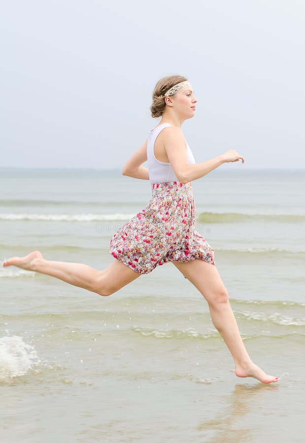 Young pretty woman running stock image. Image of movement - 32934409