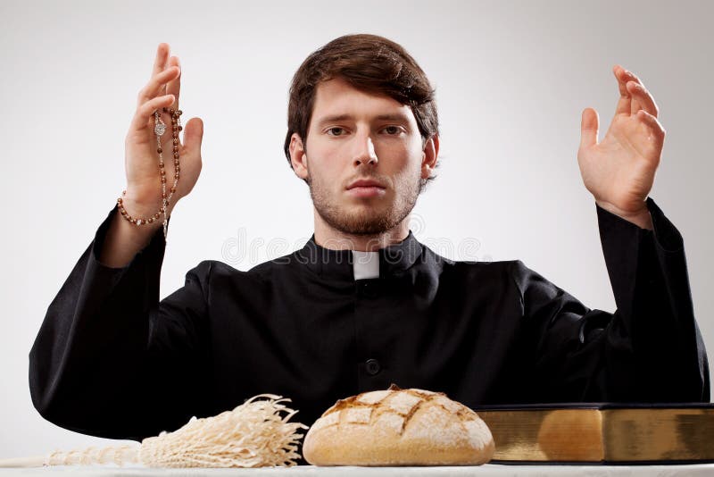 Priest with bread stock image. Image of clerical, catholicism - 38596077