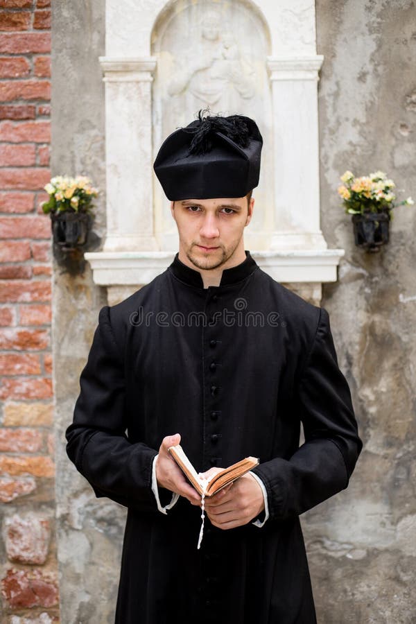 Young priest in venice stock photo. Image of canal, bible - 77180950