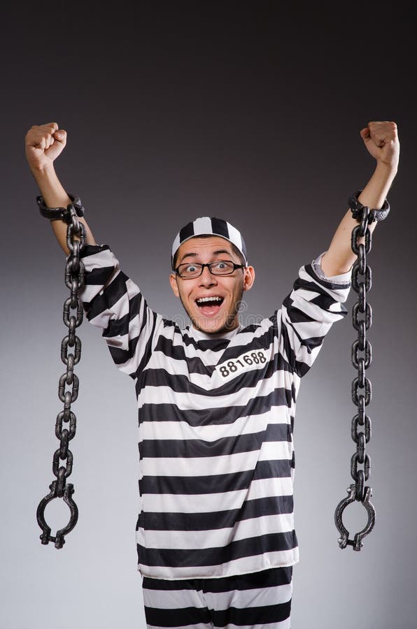 The Young Prisoner in Chains Against Gray Stock Photo - Image of ...