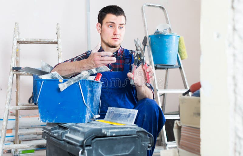 Young Professional Builder Handyman Choosing Tool in Toolbox Stock ...